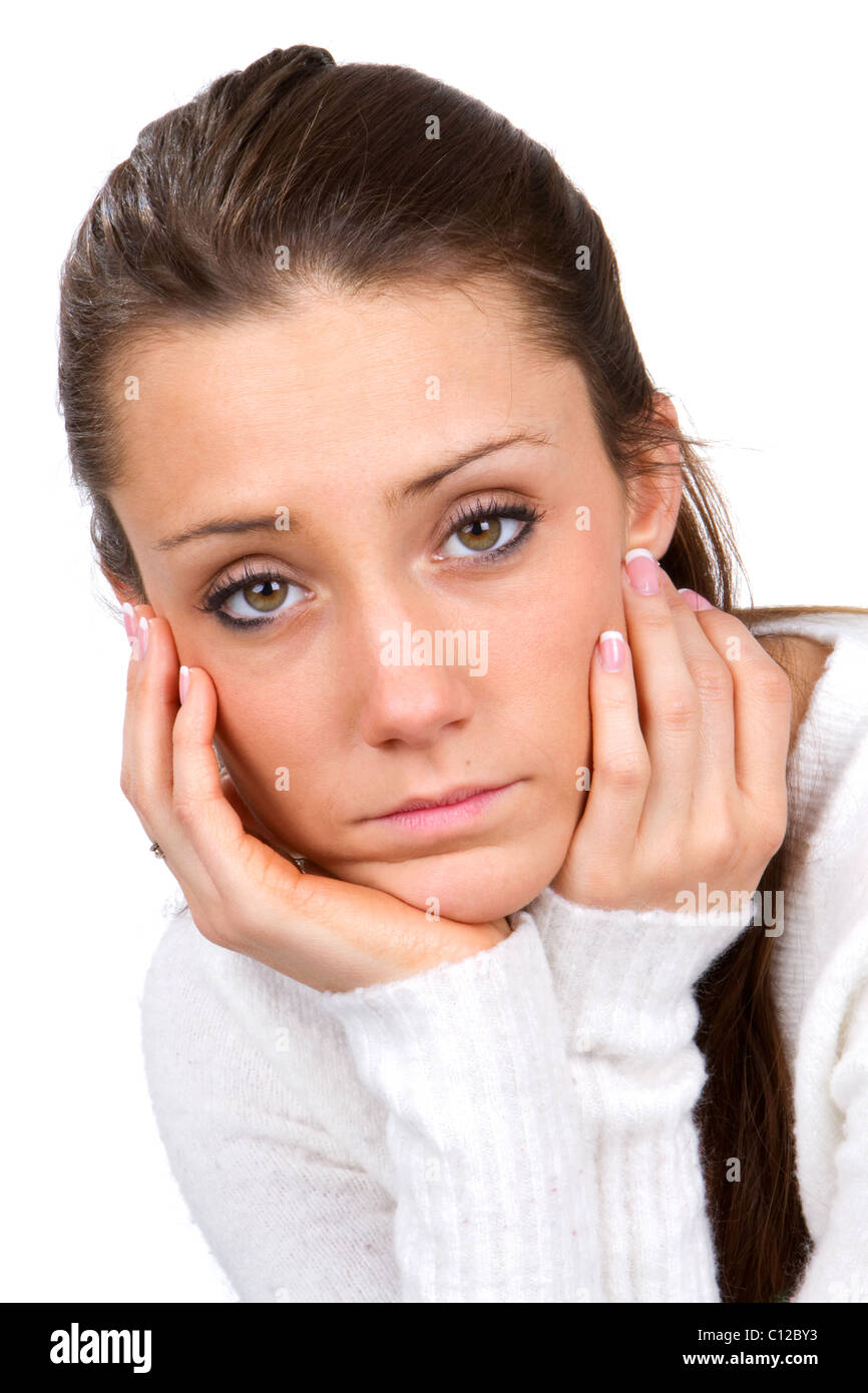 Sad Faced Young Woman Holds Her Face In Her Hands Stock Photo Alamy