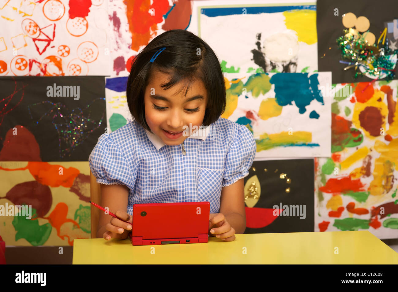 Girl playing nintendo ds in hi-res stock photography and images - Alamy