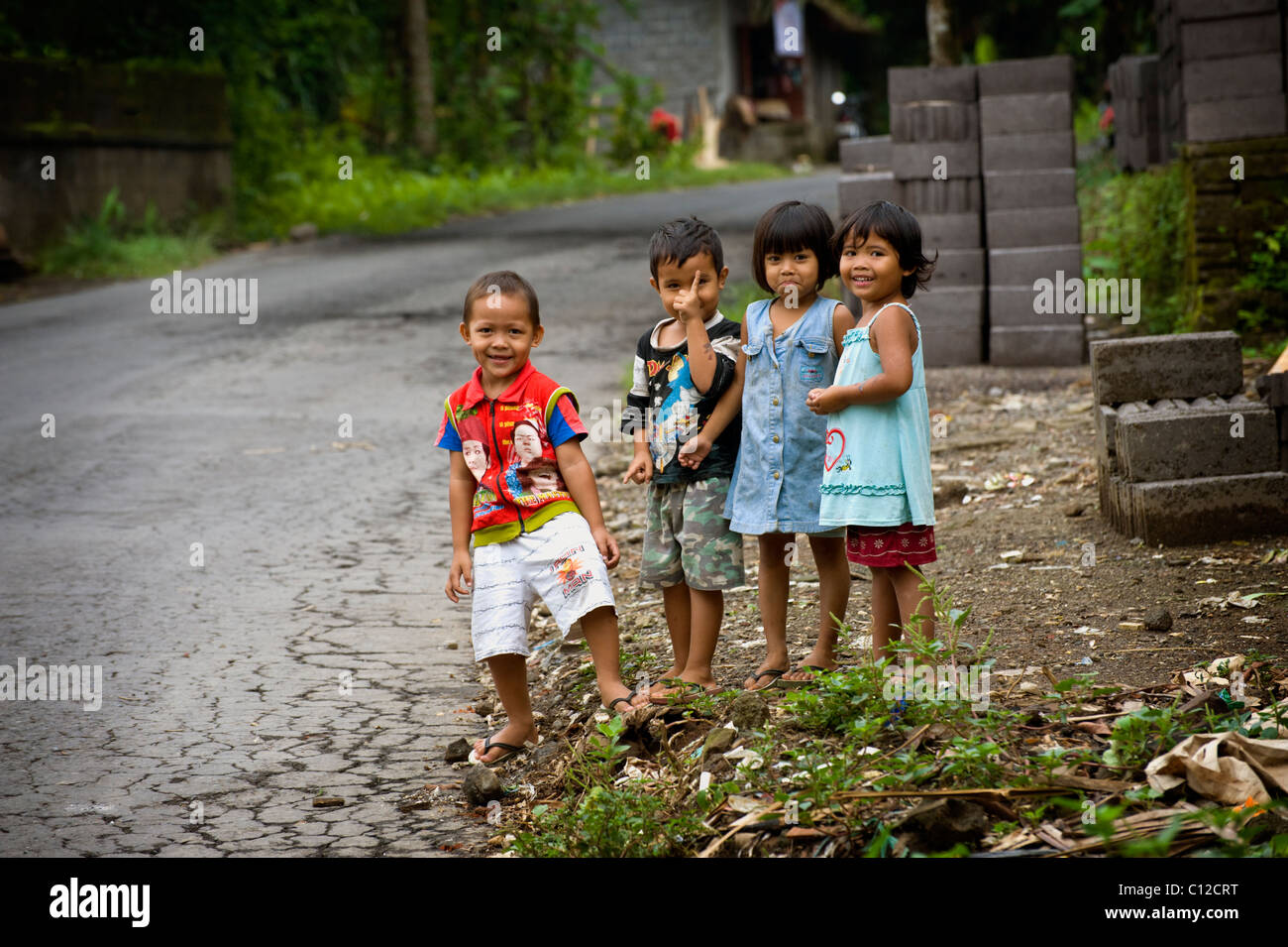 Smiling and happy Balinese children from a village in east Bali called ...