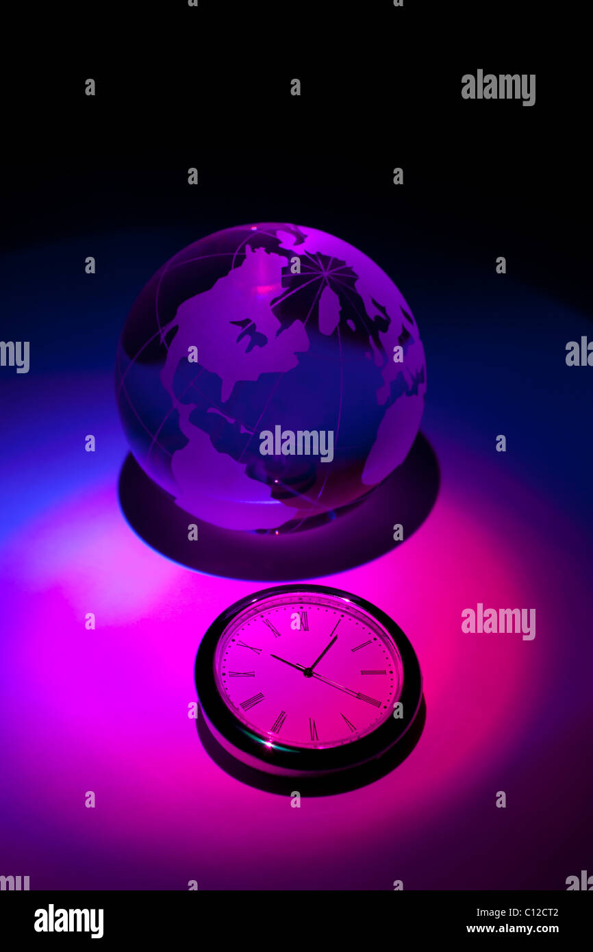 Globe and clock for background Stock Photo - Alamy