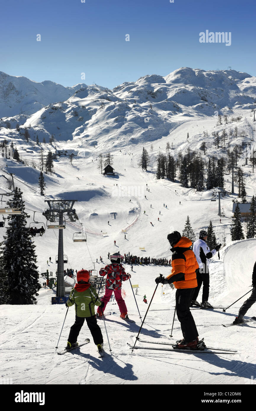 Skiers at the Vogel Ski Centre in the Triglav National Park of Slovenia ...