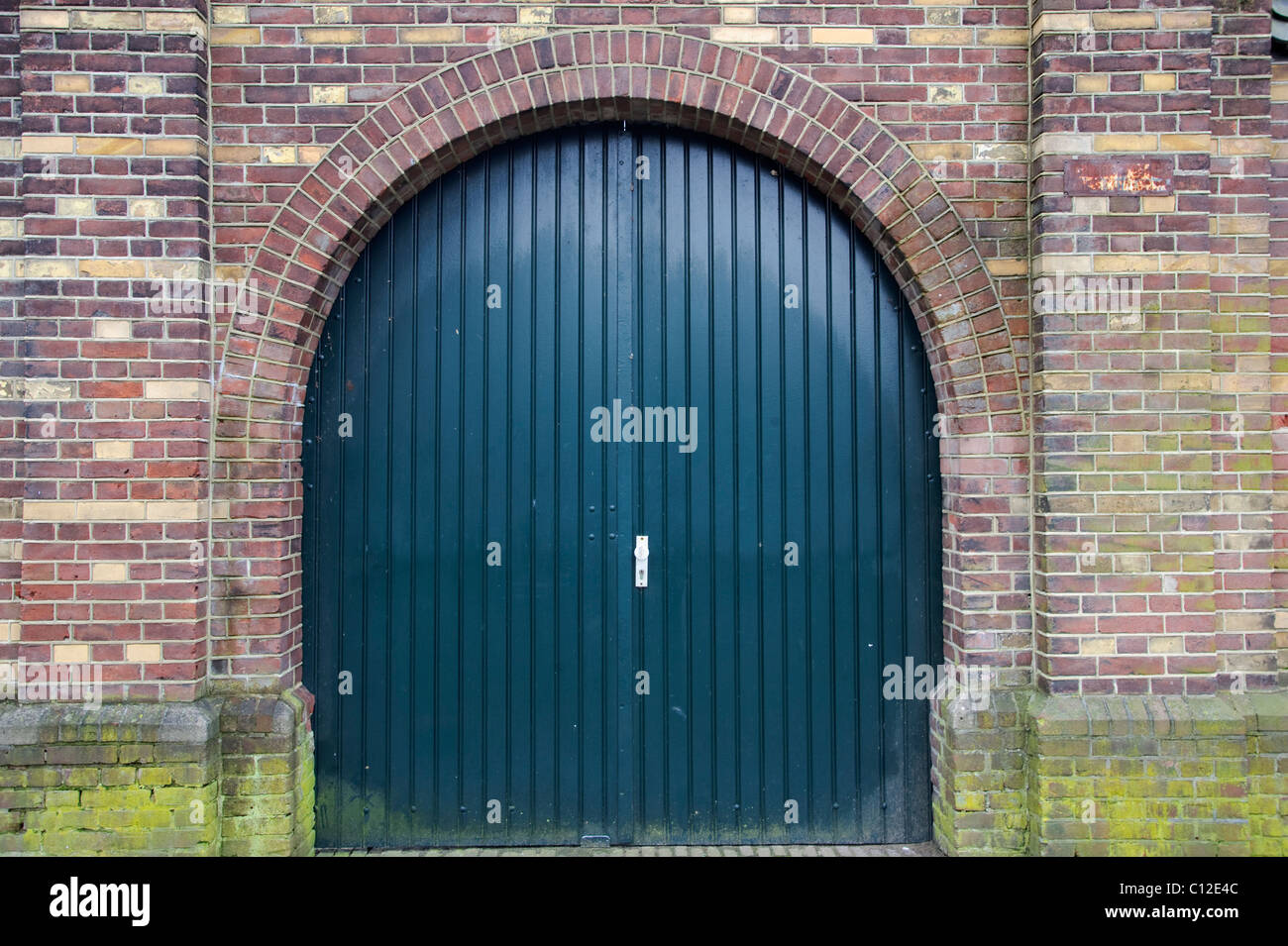 Red brick wall old gate hi-res stock photography and images - Alamy