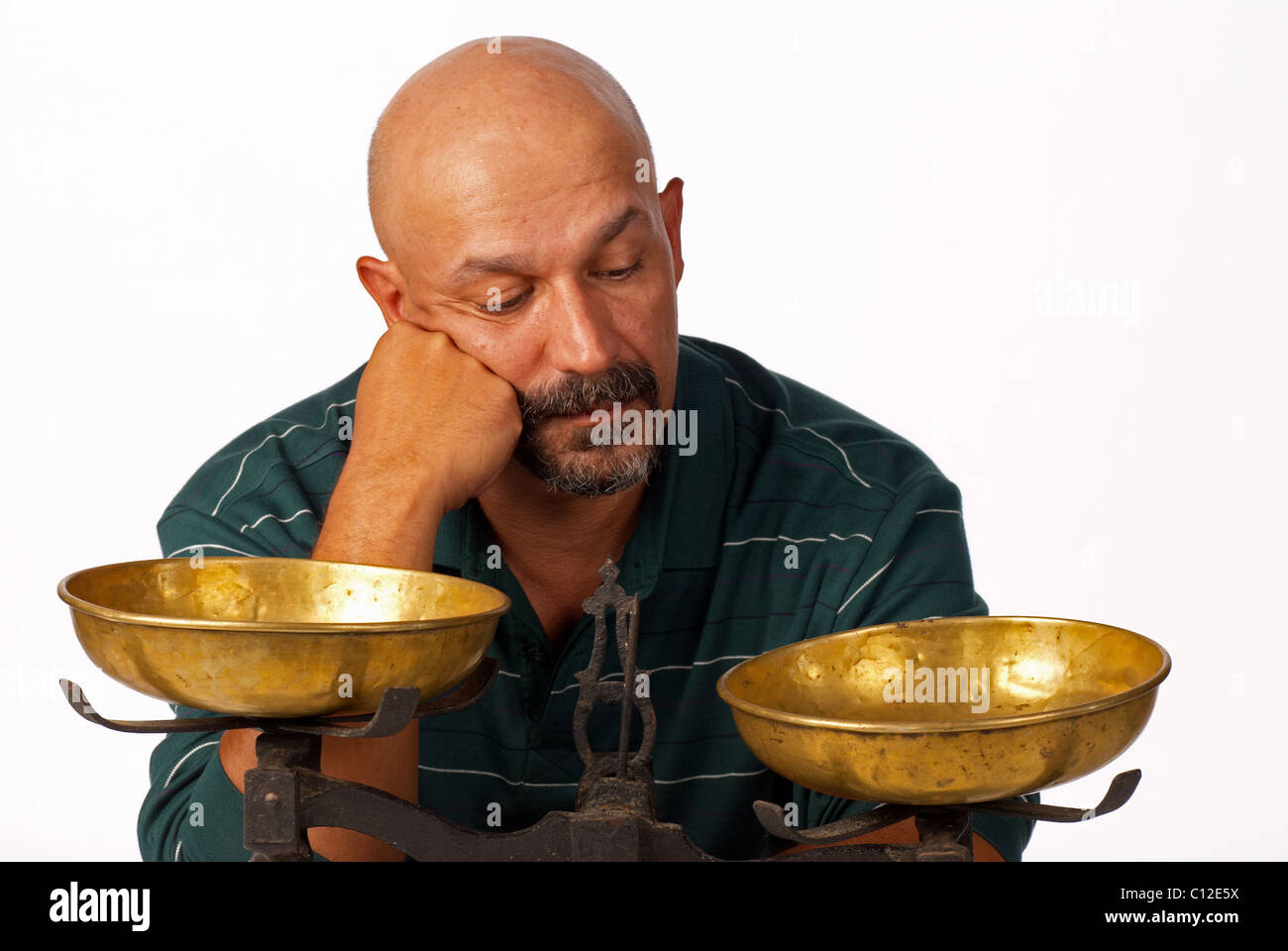Thinking about the pros and cons of a decision Stock Photo - Alamy