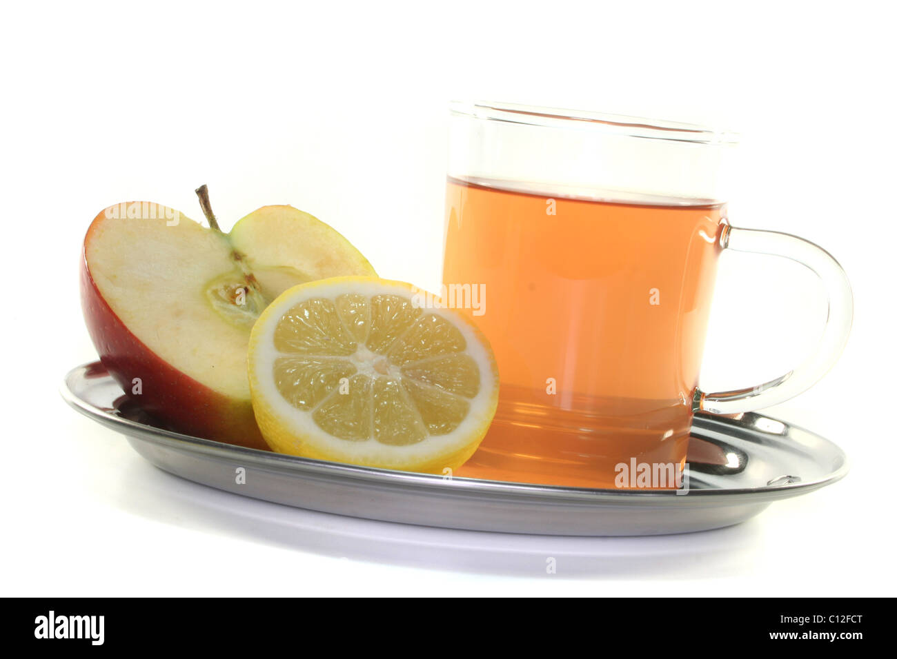 a glass of apple-lemon tea with fresh apple and lemon Stock Photo - Alamy