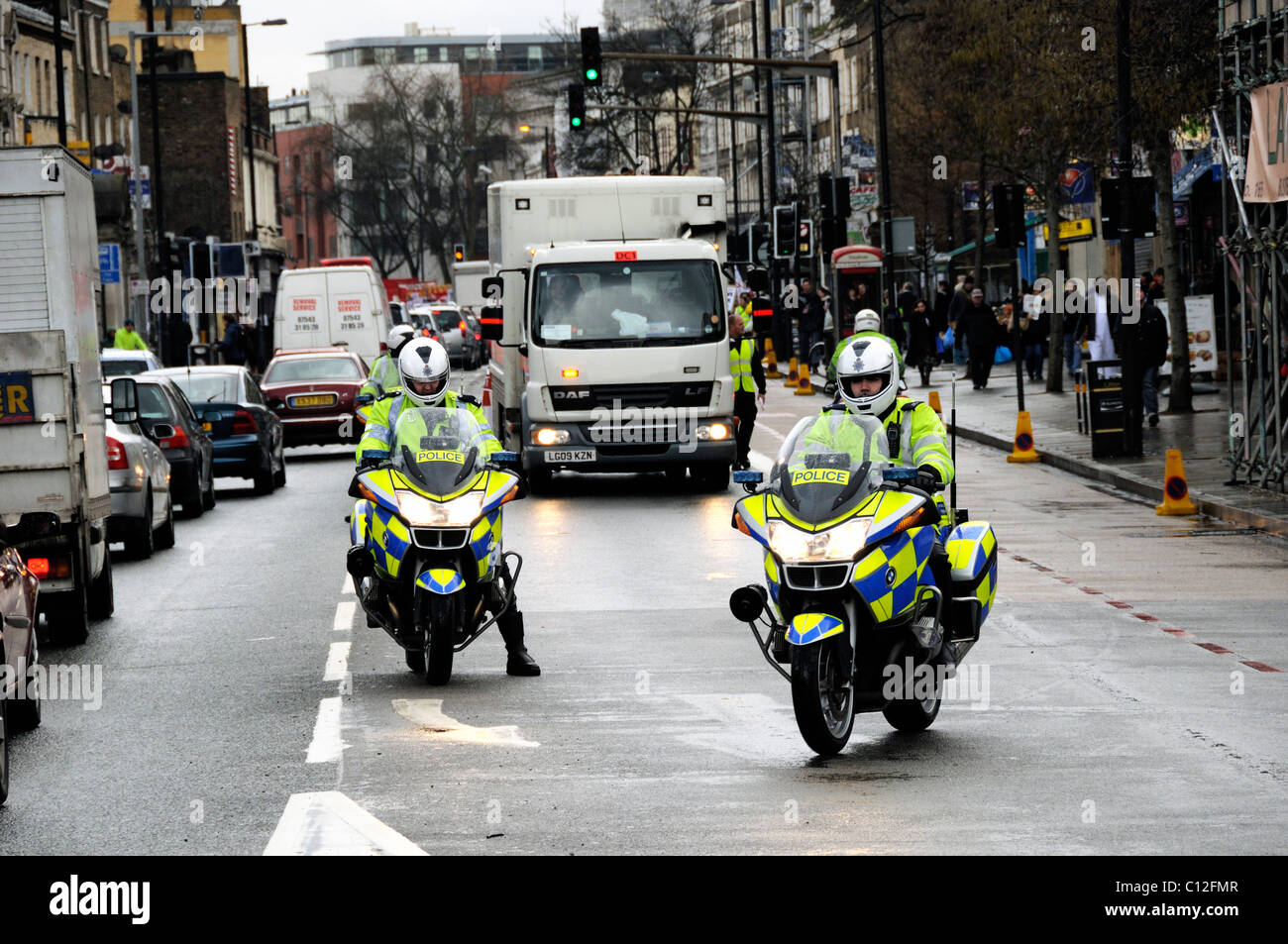 Police Motorcyclists ahead of a march Holloway Road Islington London ...