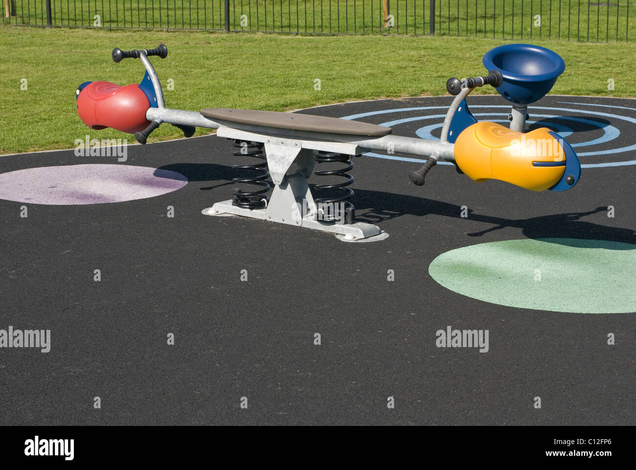 Playground see-saw in residential area Stock Photo - Alamy