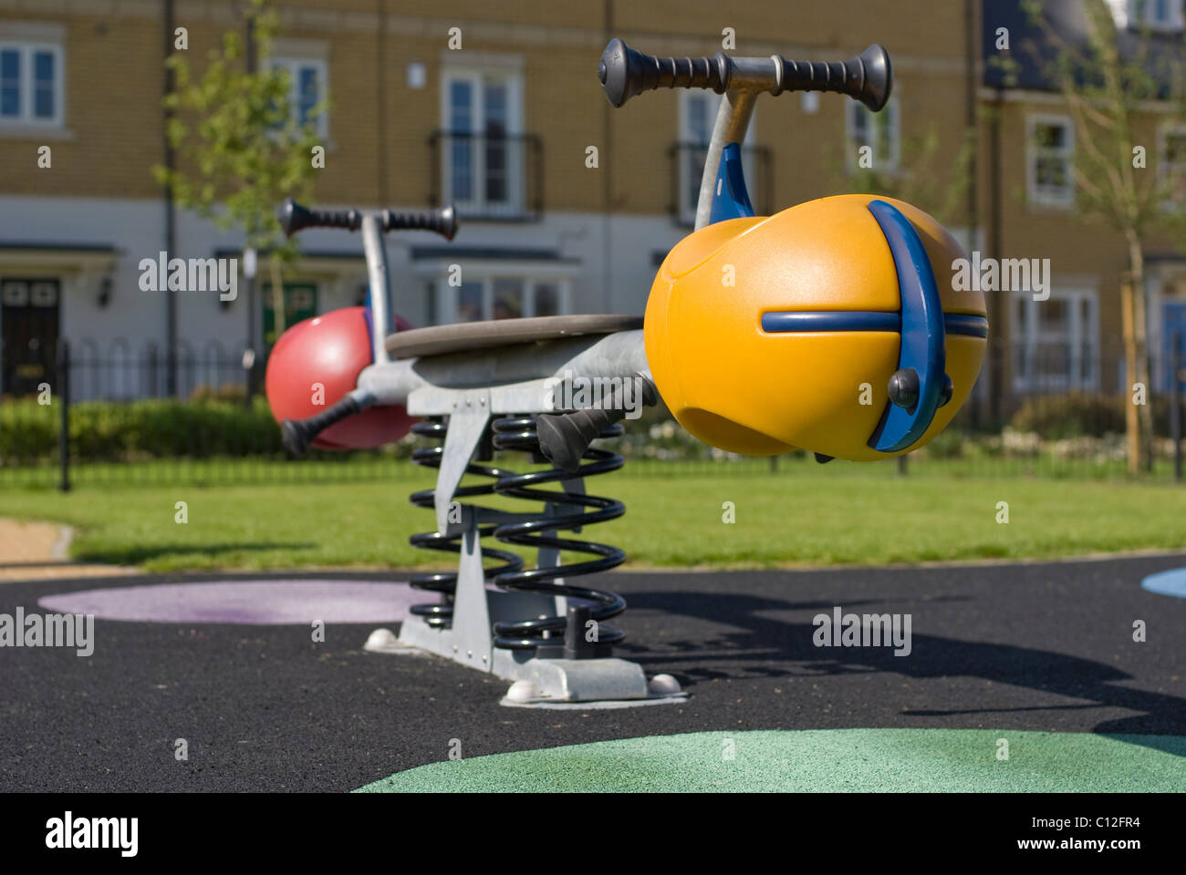 Residential playground see-saw Stock Photo - Alamy
