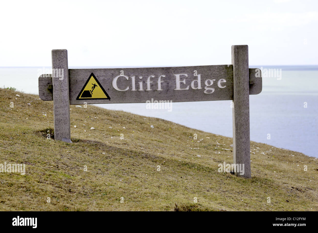 Cliff edge sign along South Downs Way, East Sussex, England, UK Stock ...