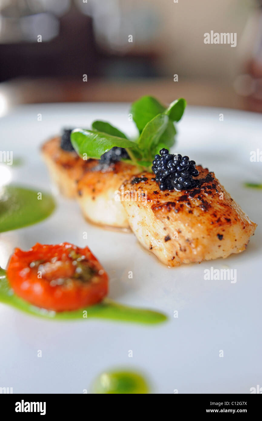 Seared scallops topped with caviar as cooked at The Medicine Chest ...