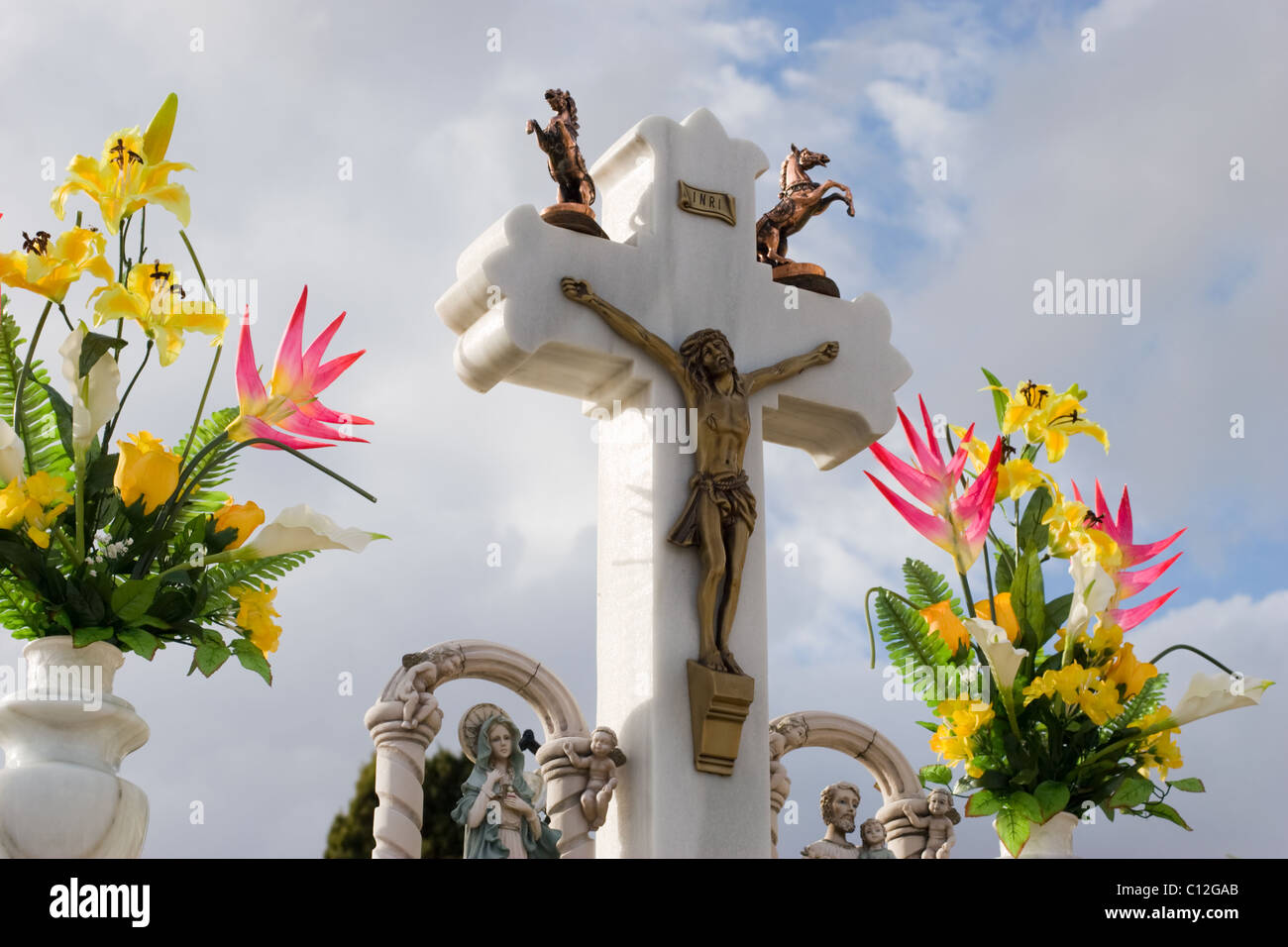 Marble cross with flowers Stock Photo - Alamy