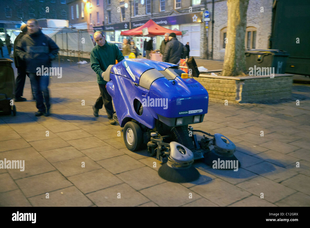 Man sweeping street hi-res stock photography and images - Alamy