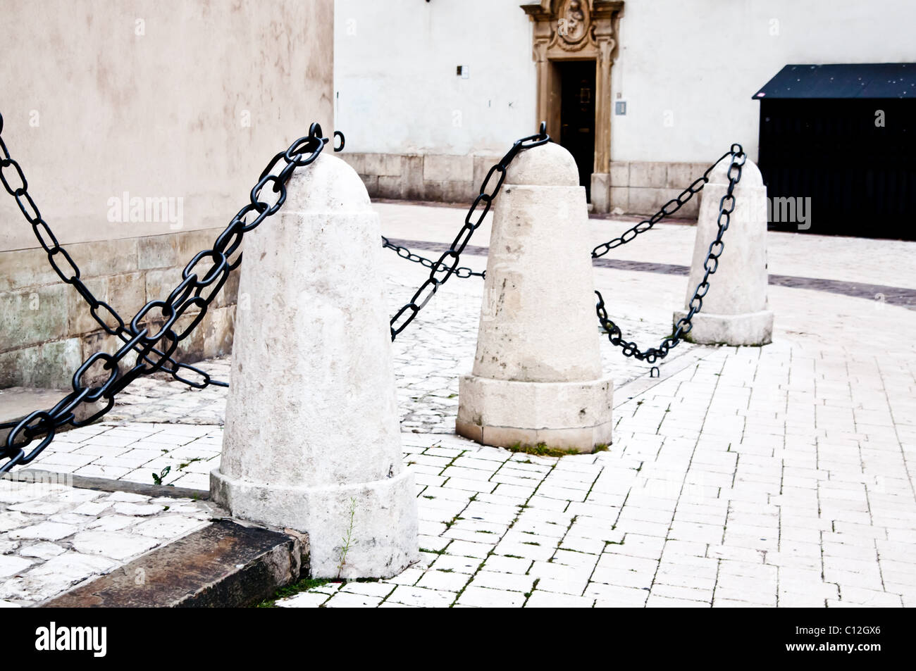 stone barricade with chain Stock Photo - Alamy