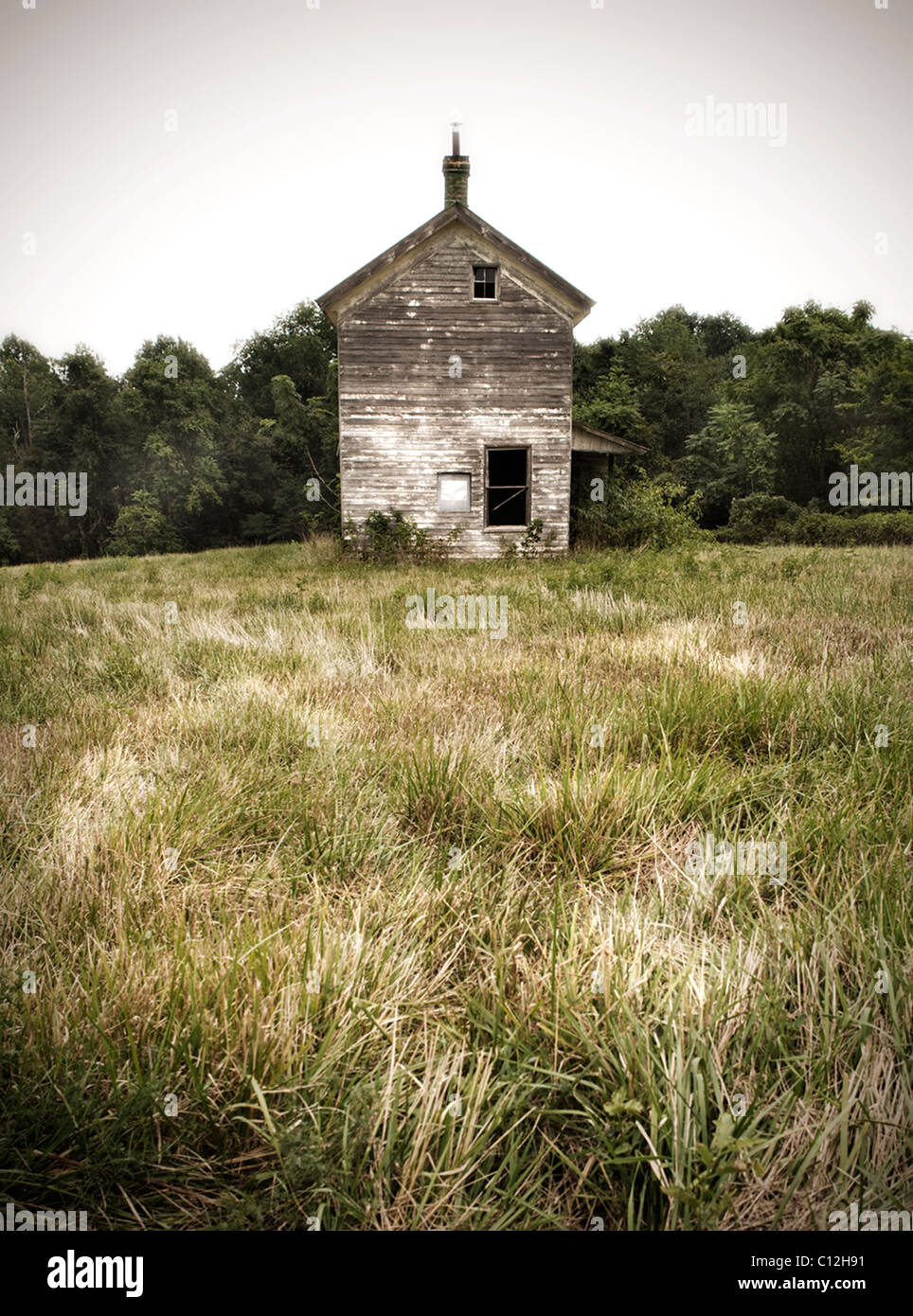 An old run down house sits in an open field on a farm in Virginia ...