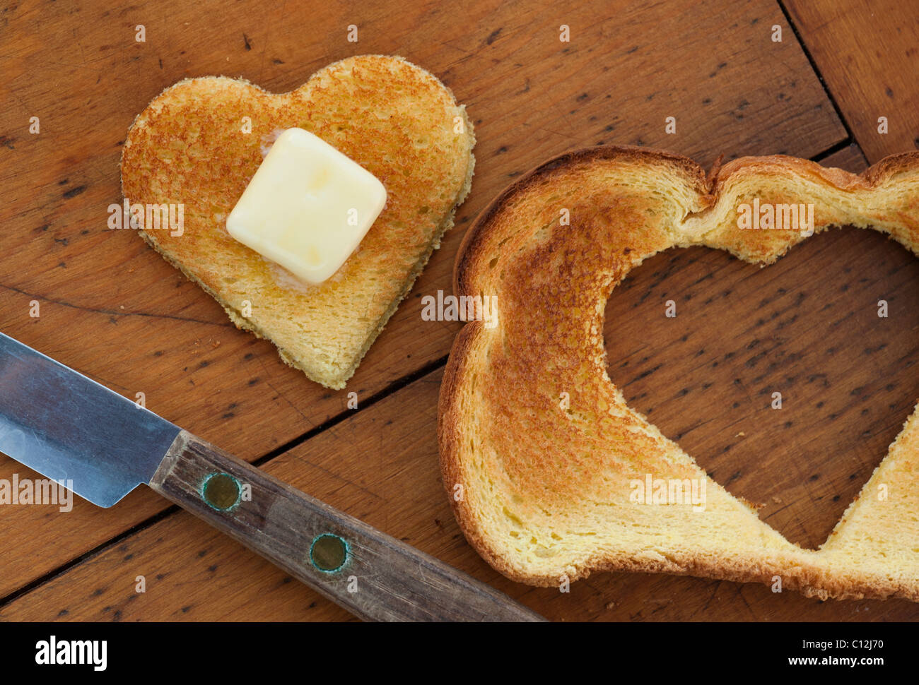 Heart shaped toast on table Stock Photo - Alamy