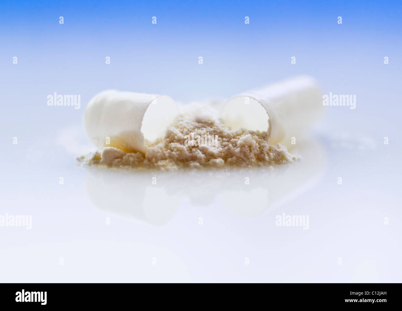 Close up of broken drug capsule Stock Photo - Alamy