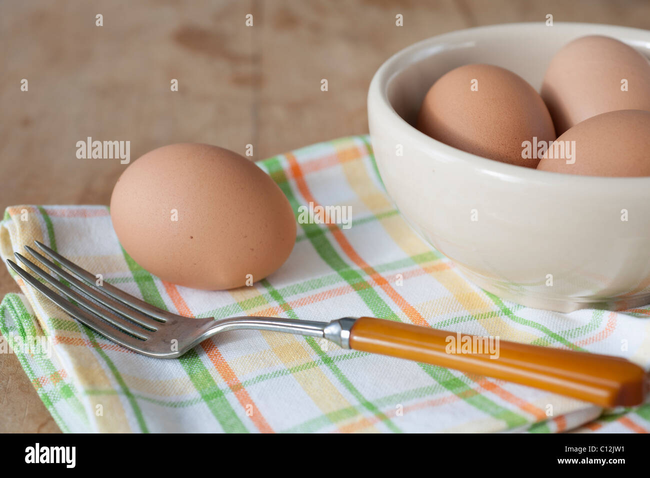 Bowl of boiled eggs with fork Stock Photo - Alamy