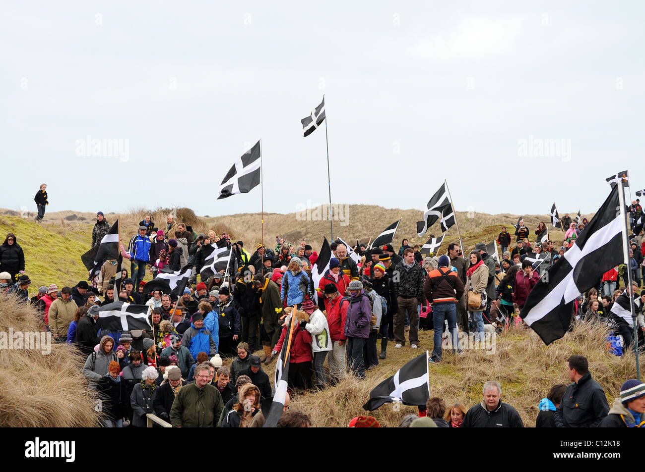 Cornish people marching through the dunes at Perranporth,Cornwall,UK ...