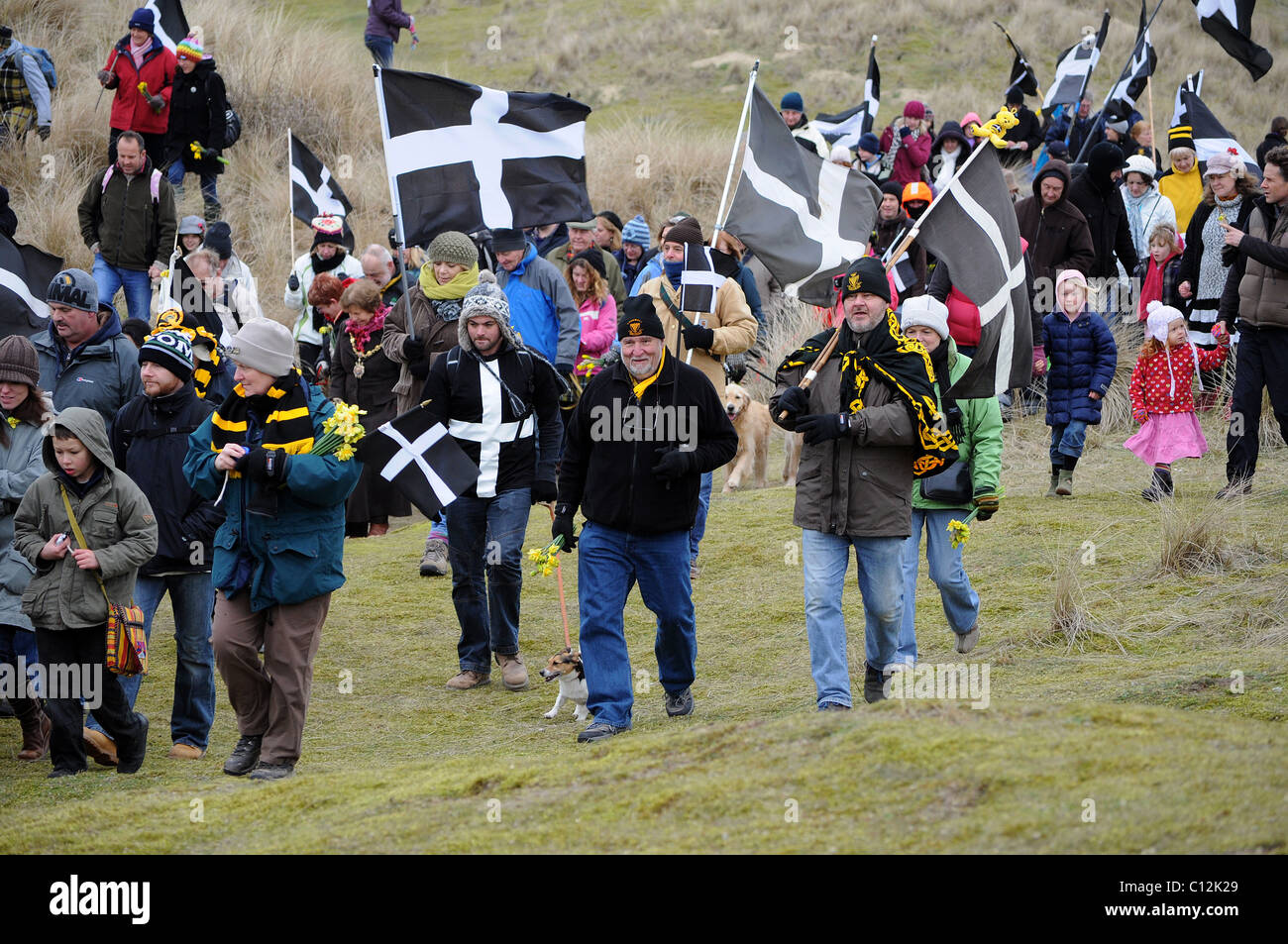 Cornish people march through the dunes at Perranporth, Cornwall, UK ...