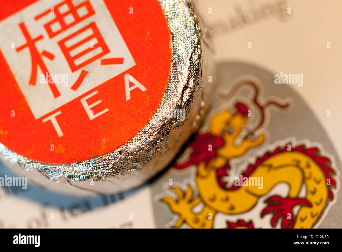 Close up photograph of a Chinese tea tablet wrapped in brown paper ...