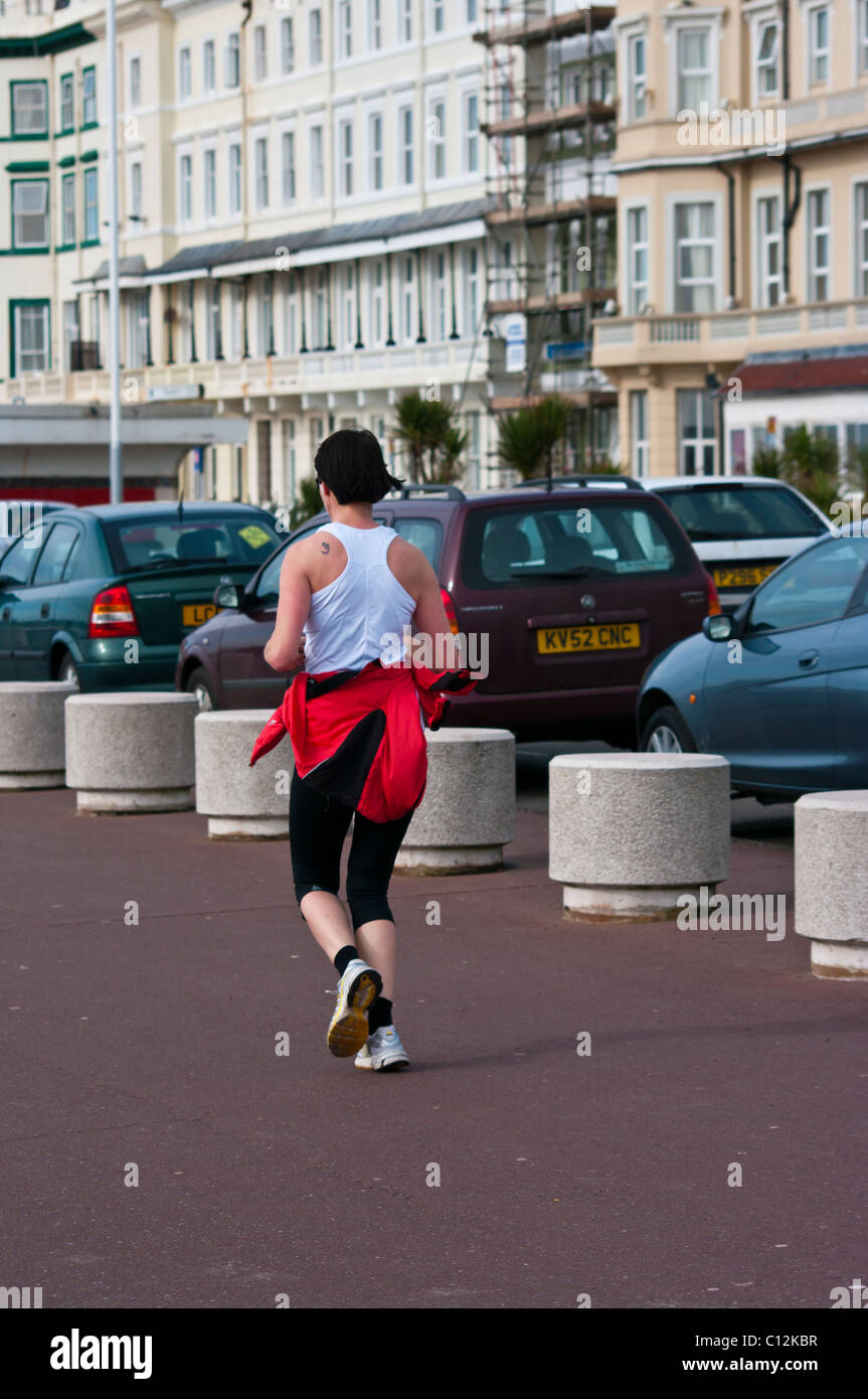 Rear View Of A Woman Jogging Stock Photo - Alamy