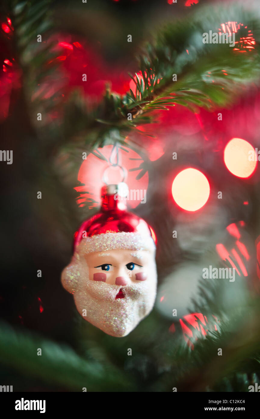 Santa Claus Christmas decoration hanging on Christmas tree, studio shot ...