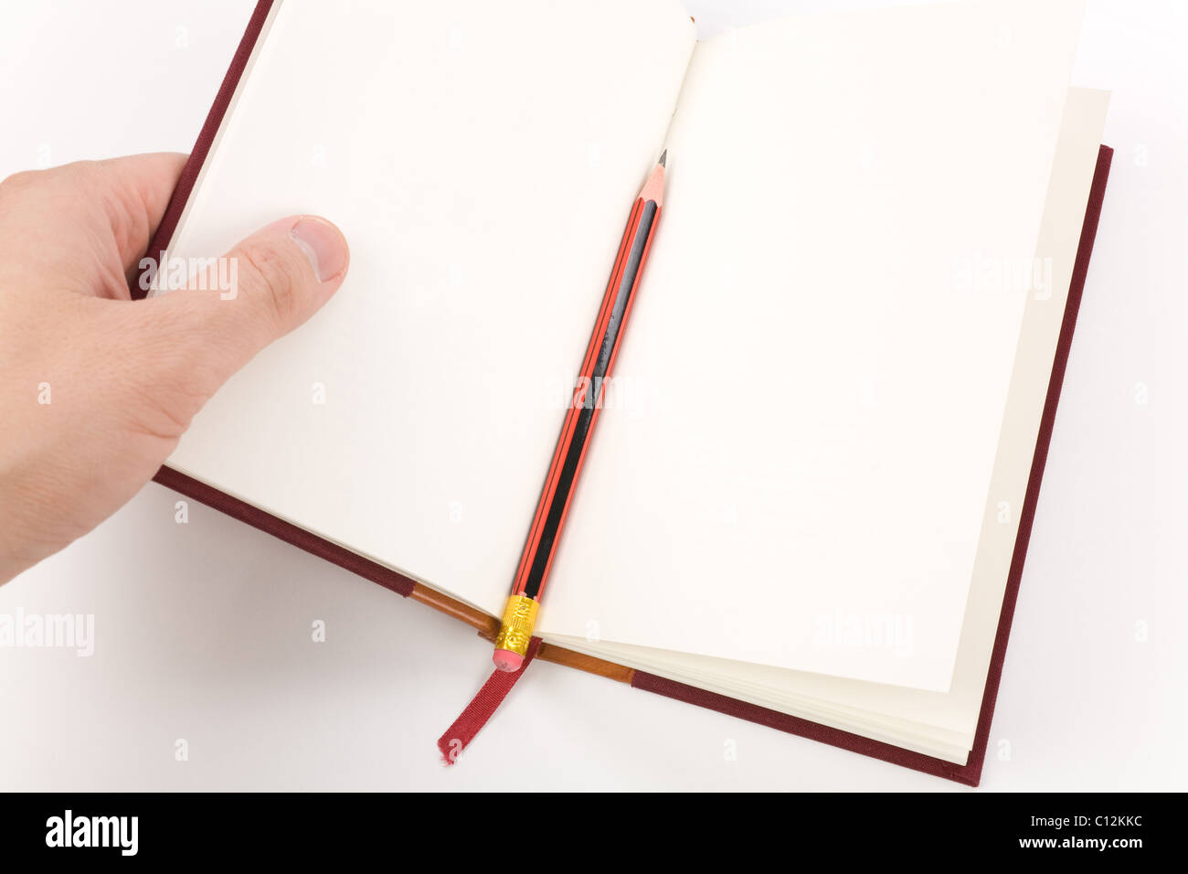 book and pencil close up shot Stock Photo - Alamy