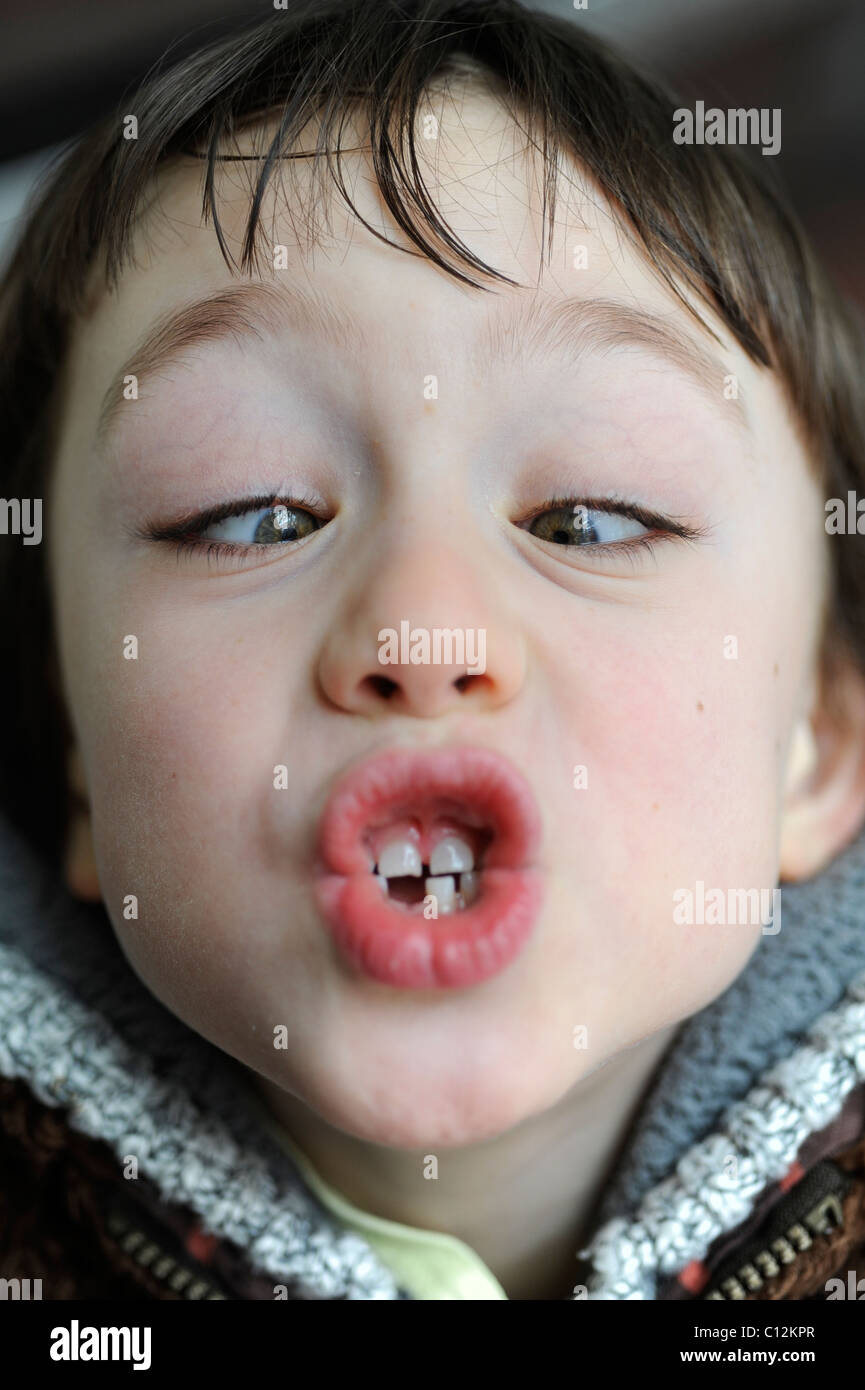 6 year old boy loses his first tooth Stock Photo - Alamy