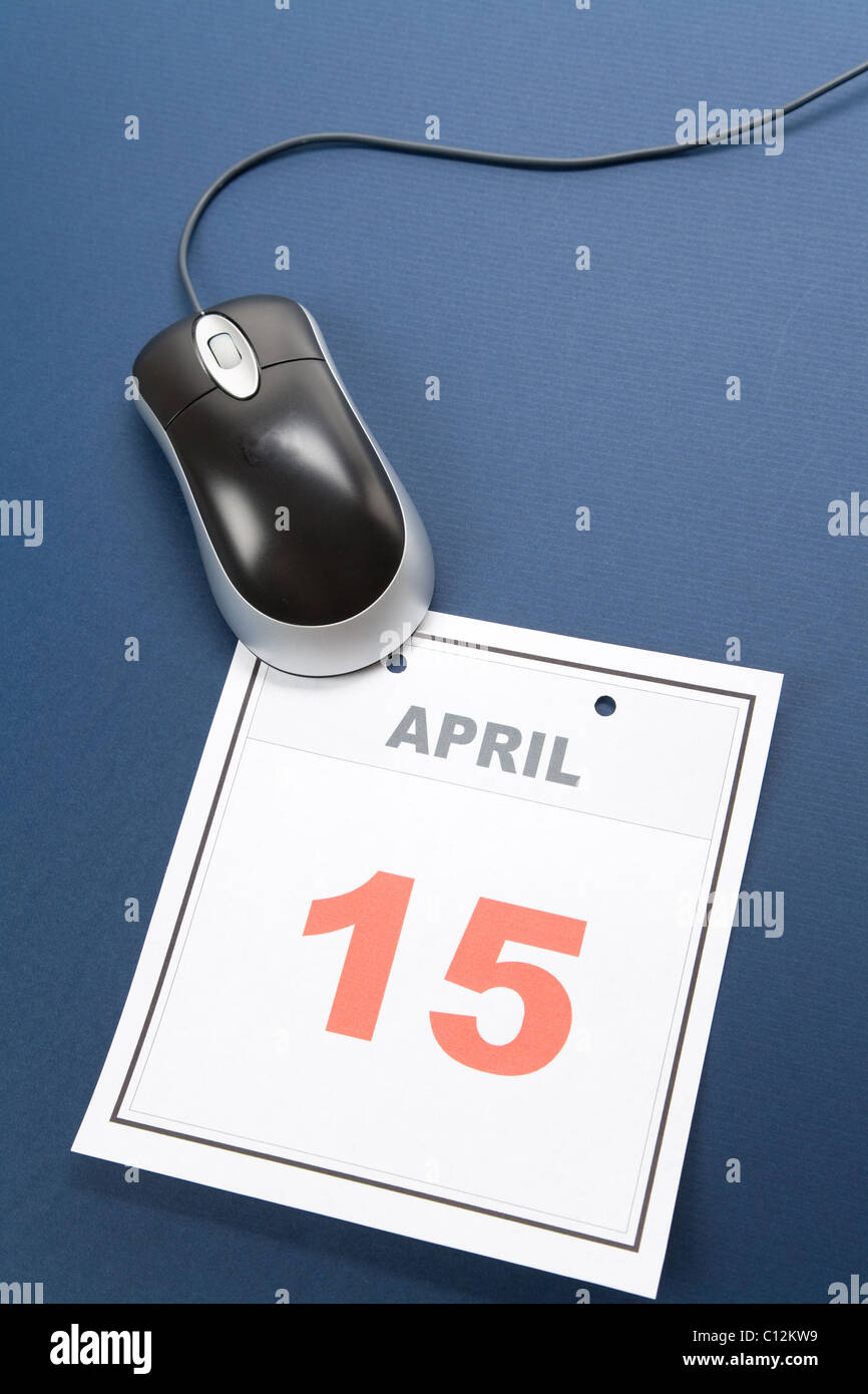 Tax Day, calendar date April 15 and computer mouse for background Stock ...