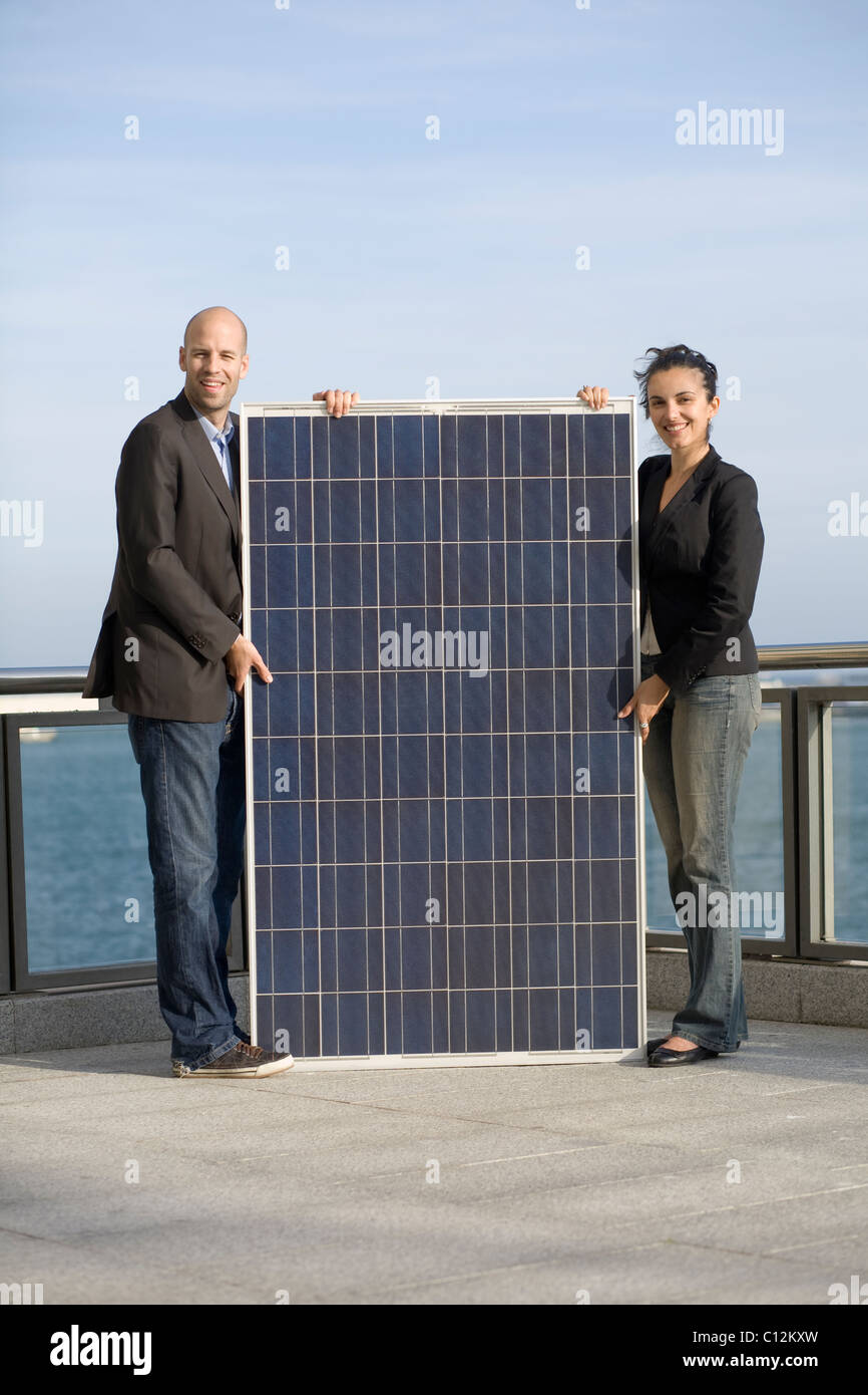 Solar energy couple Stock Photo - Alamy