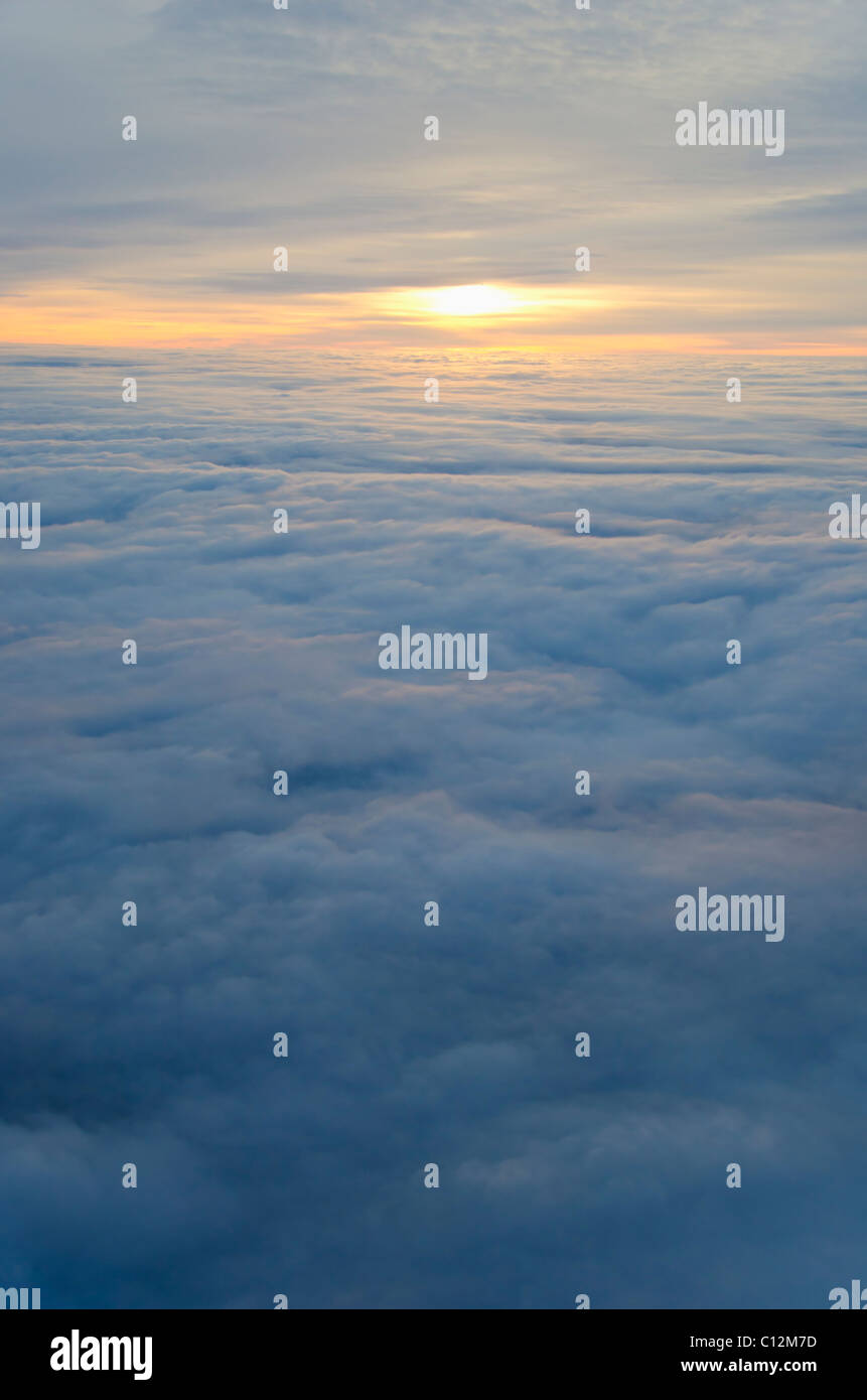 Sunrise over clouds Stock Photo - Alamy