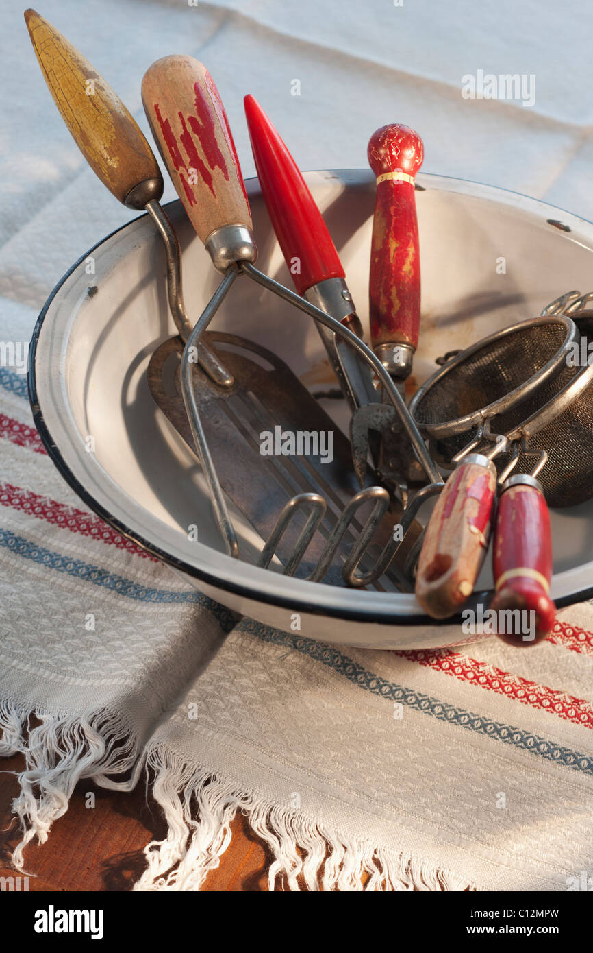 Antique cooking utensils in bowl Stock Photo - Alamy