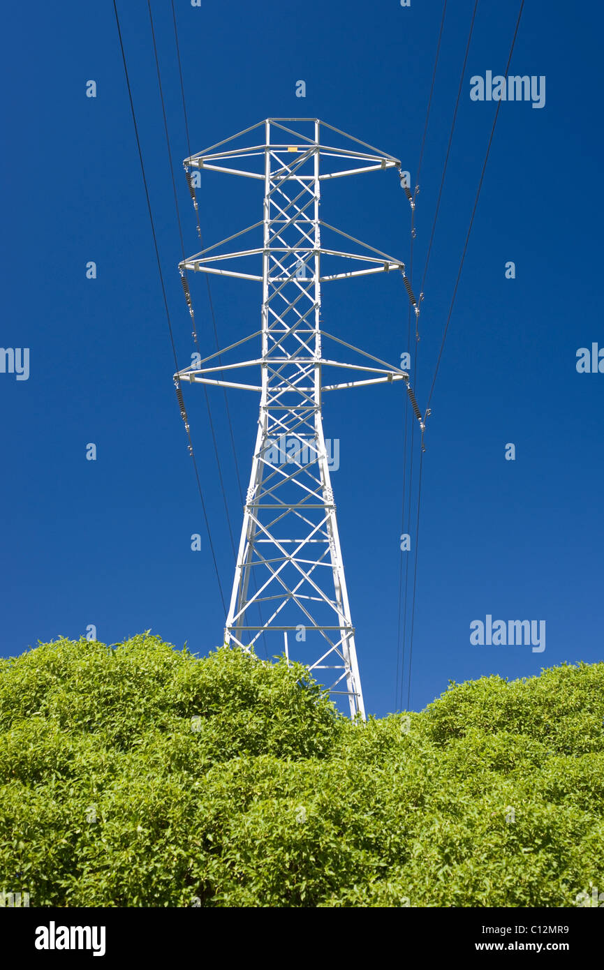 11000 volt pylons against rich deep blue clear sky can depict visual ...