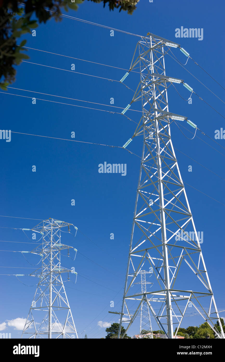 11000 volt pylons against rich deep blue clear sky can depict visual ...