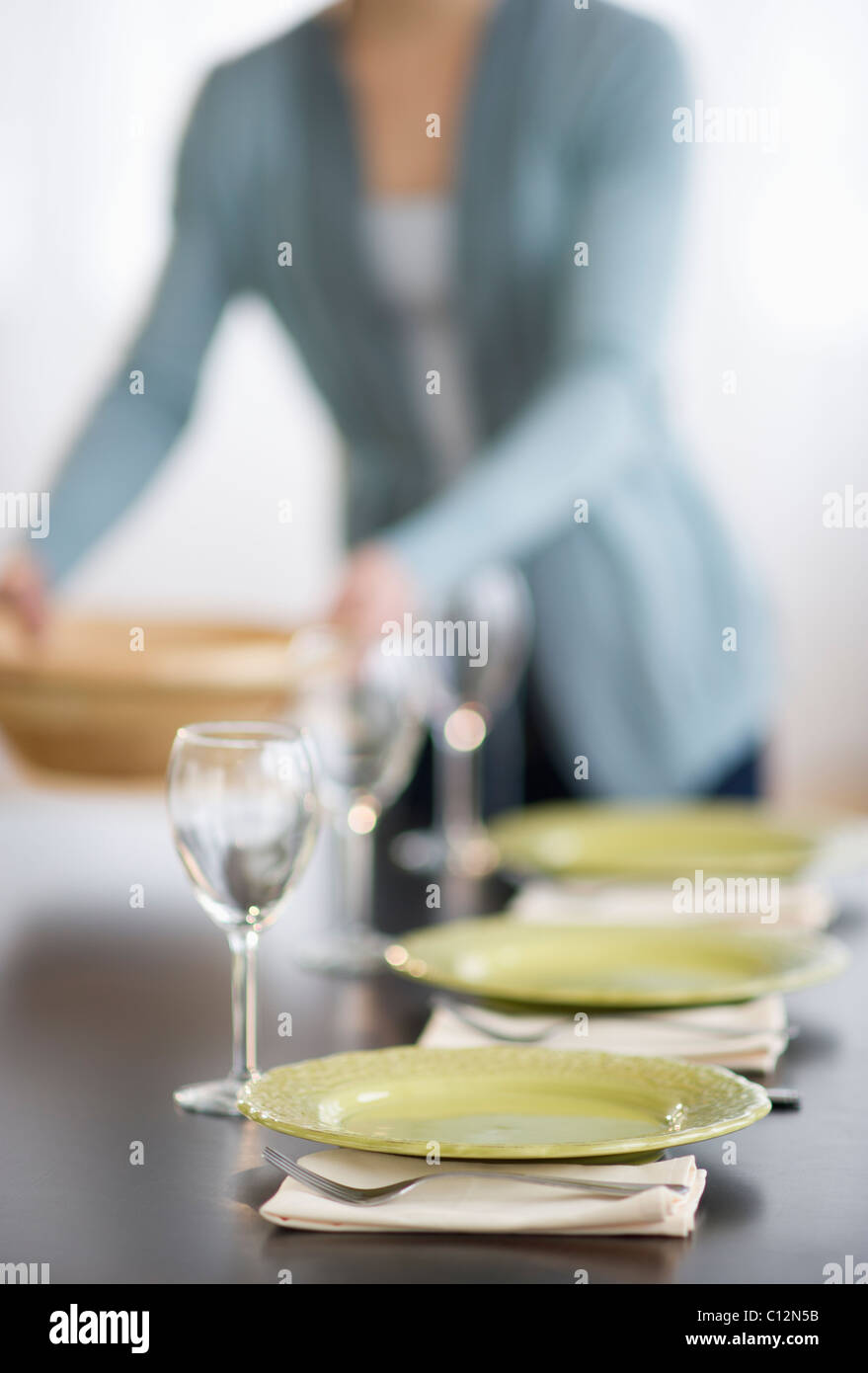 USA, New Jersey, Jersey City, Young woman setting table Stock Photo - Alamy