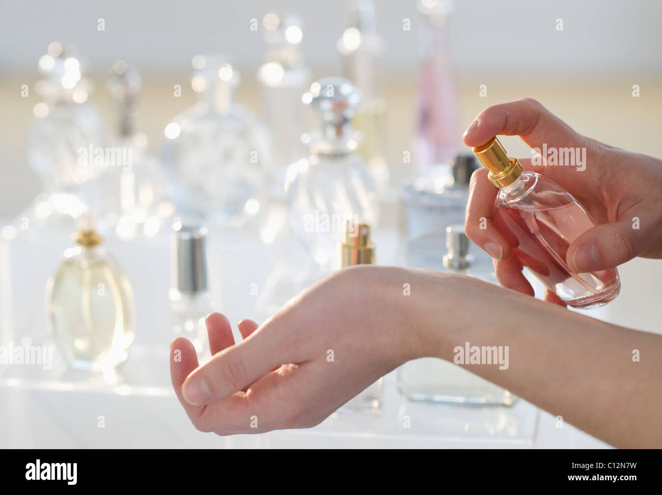 USA, New Jersey, Jersey City, Young woman testing perfume Stock Photo ...