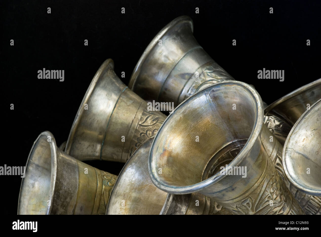 Closeup of vintage metal musical horns as if they are playing loudly ...