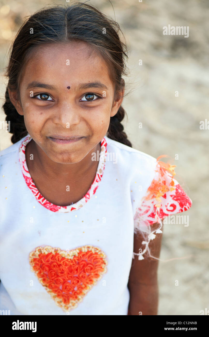 Smiling happy rural Indian village girl with a heart on her t-shirt ...