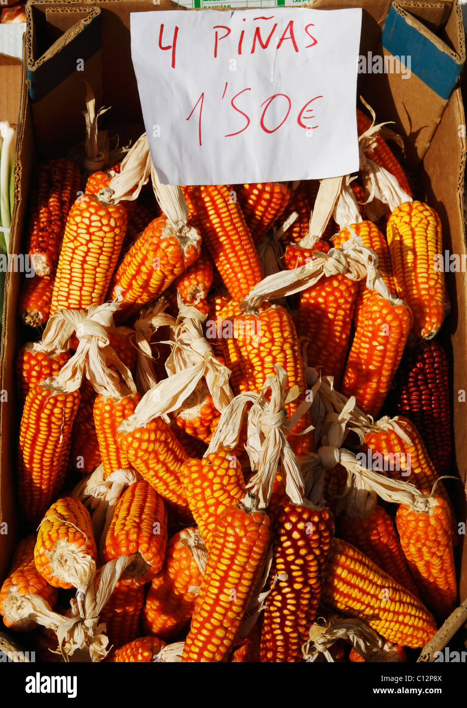 Box of corn on the cob on market stall in Spain Stock Photo - Alamy