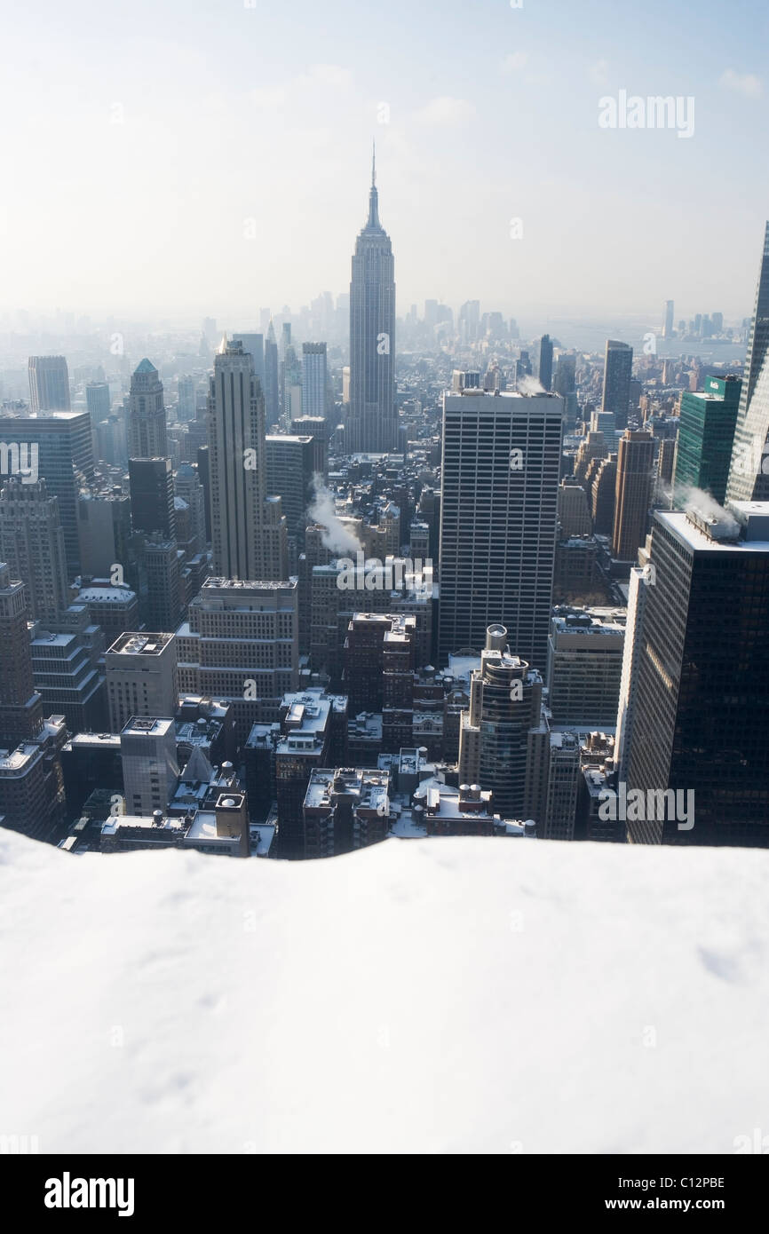 USA, New York City, View of Manhattan covered with snow, with Empire ...