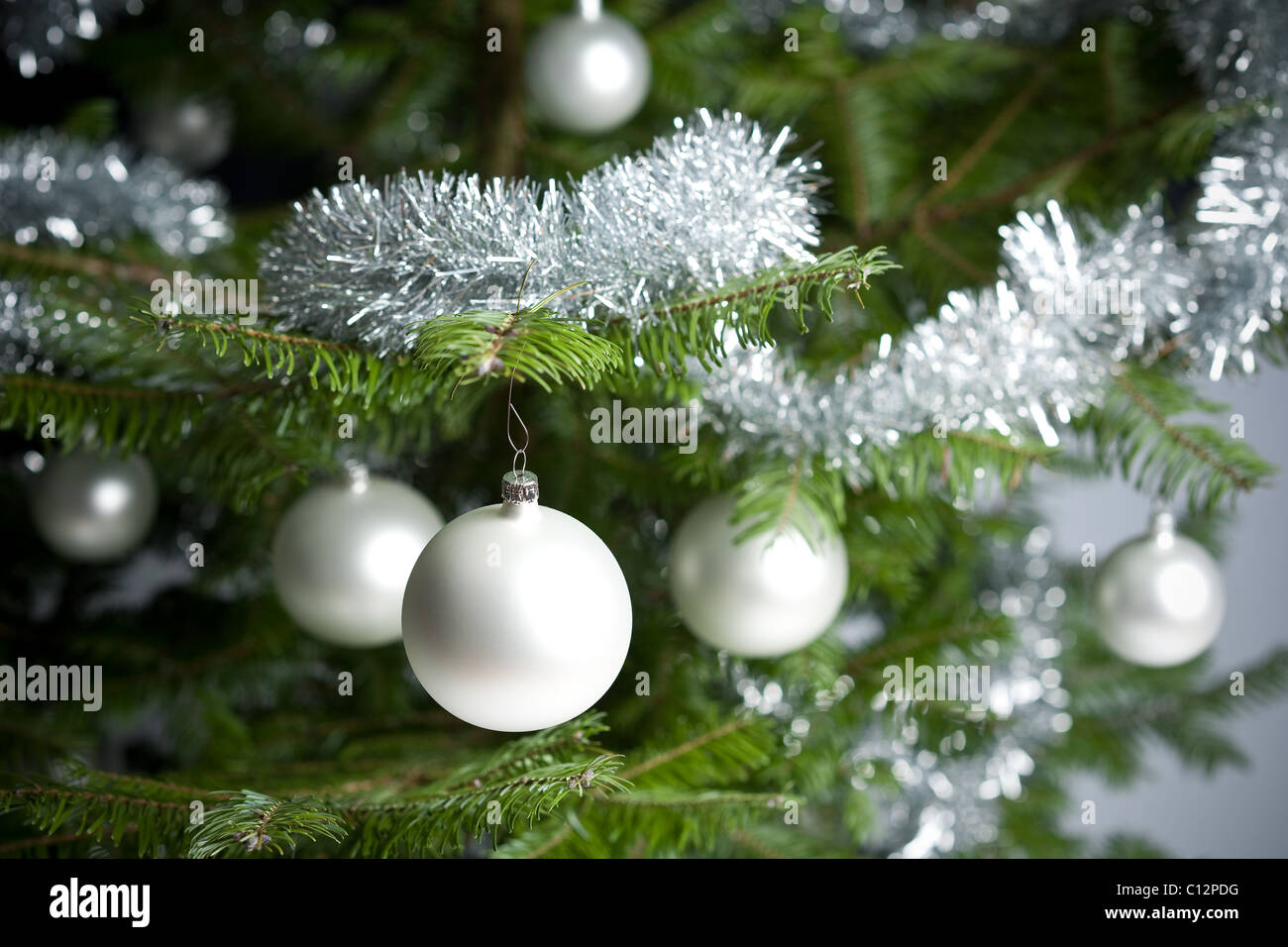 Silver decorated Christmas fir tree with balls and chains Stock Photo ...