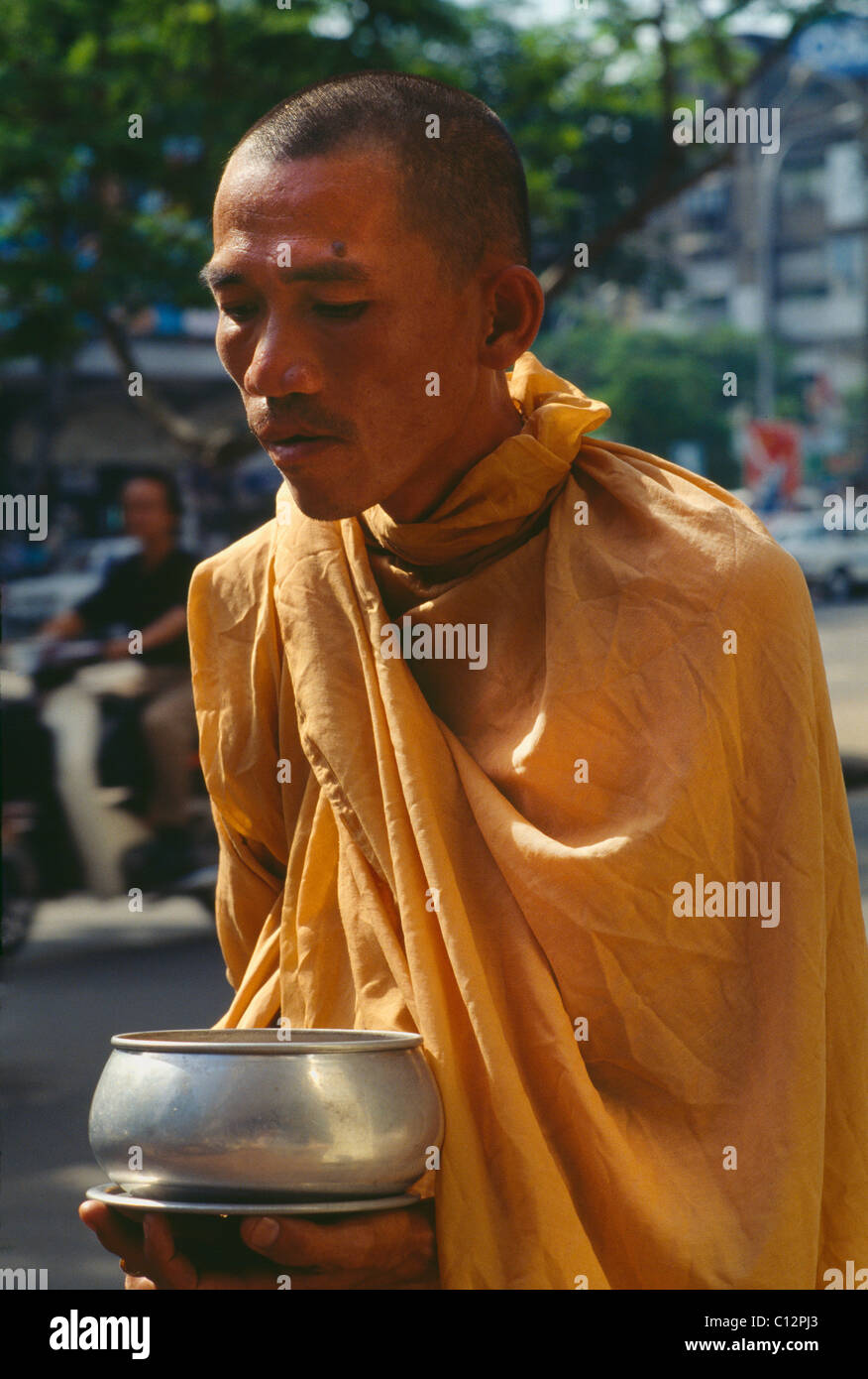 Begging monk in Saigon, Vietnam Stock Photo - Alamy