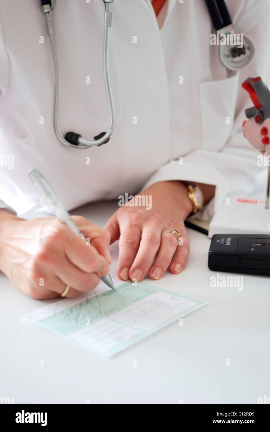 Doctor writing a prescription Stock Photo - Alamy