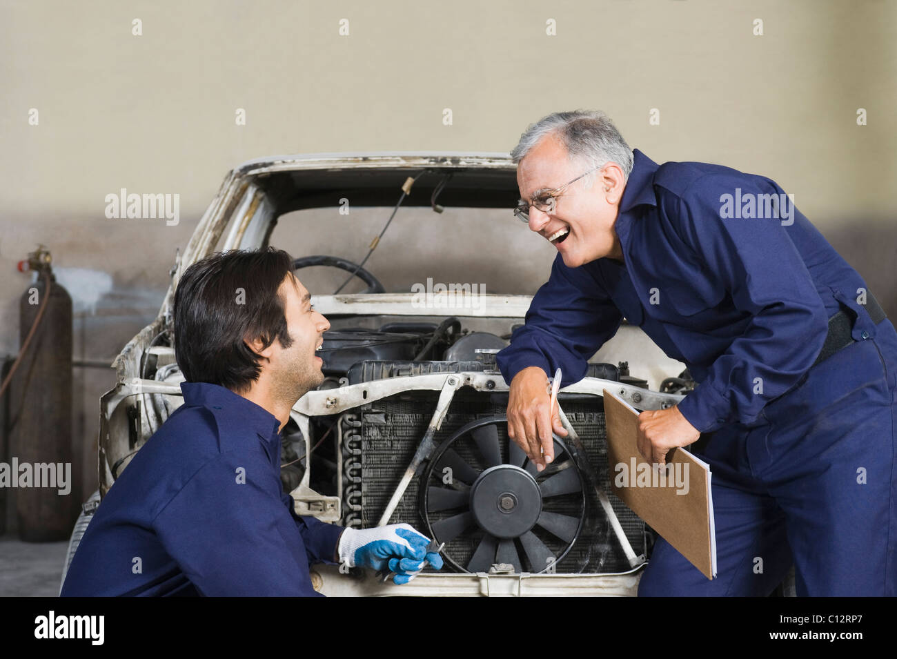Mechanic laughing hi-res stock photography and images - Alamy