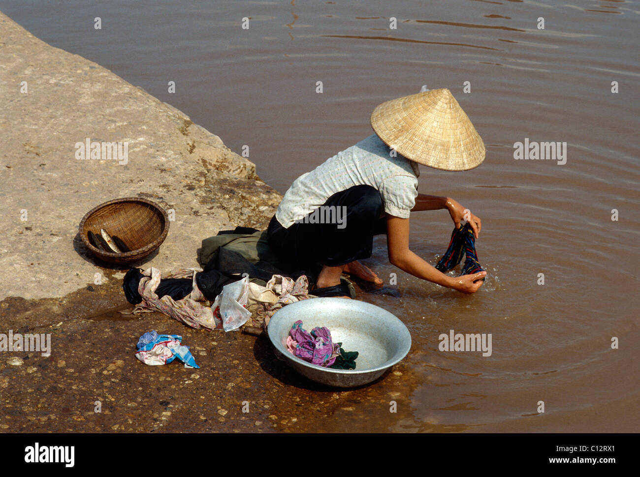 Woman washing clothes river hi-res stock photography and images - Alamy