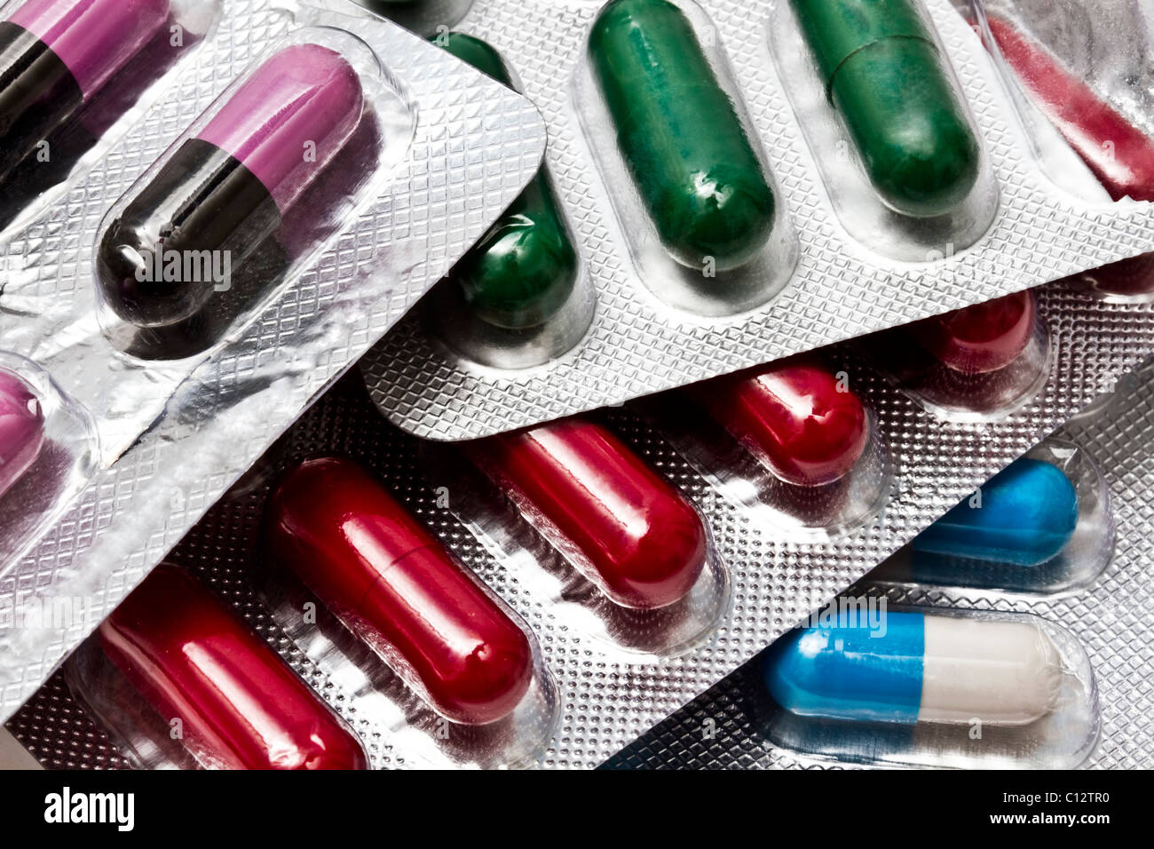Different capsules and pills closeup on white background Stock Photo ...