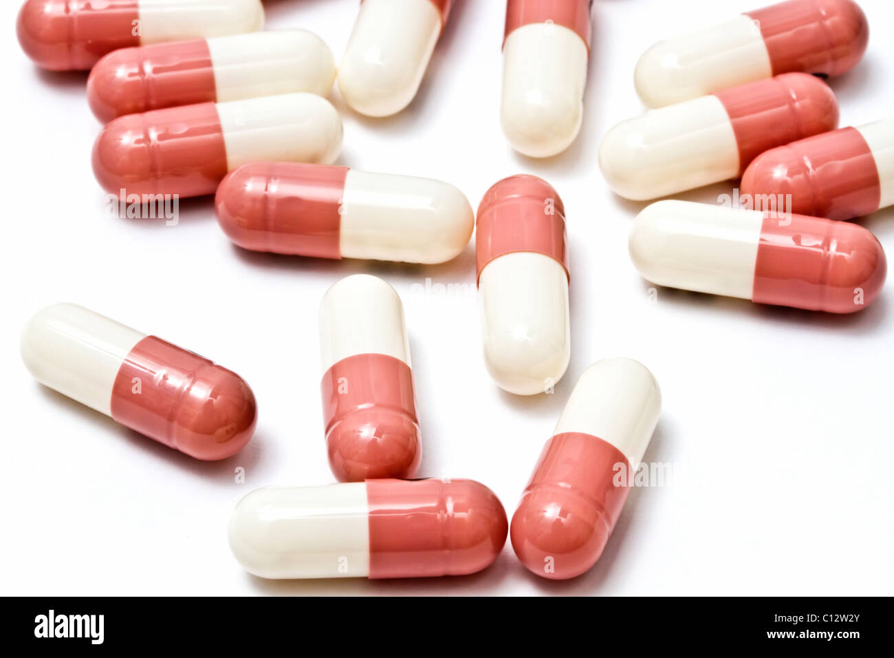 Capsules closeup on white background Stock Photo - Alamy