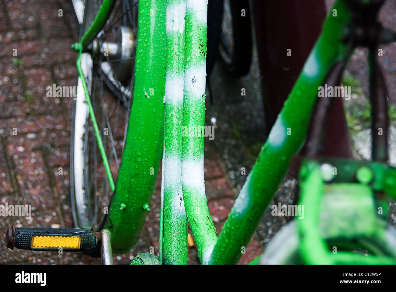 Green bicycle frame in rain, Amsterdam, Holland Stock Photo - Alamy