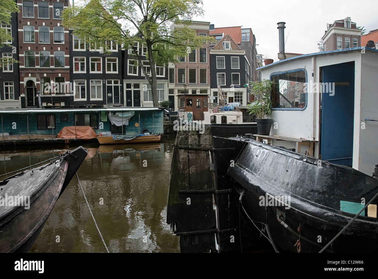 Canal boats in Amsterdam, Holland Stock Photo - Alamy