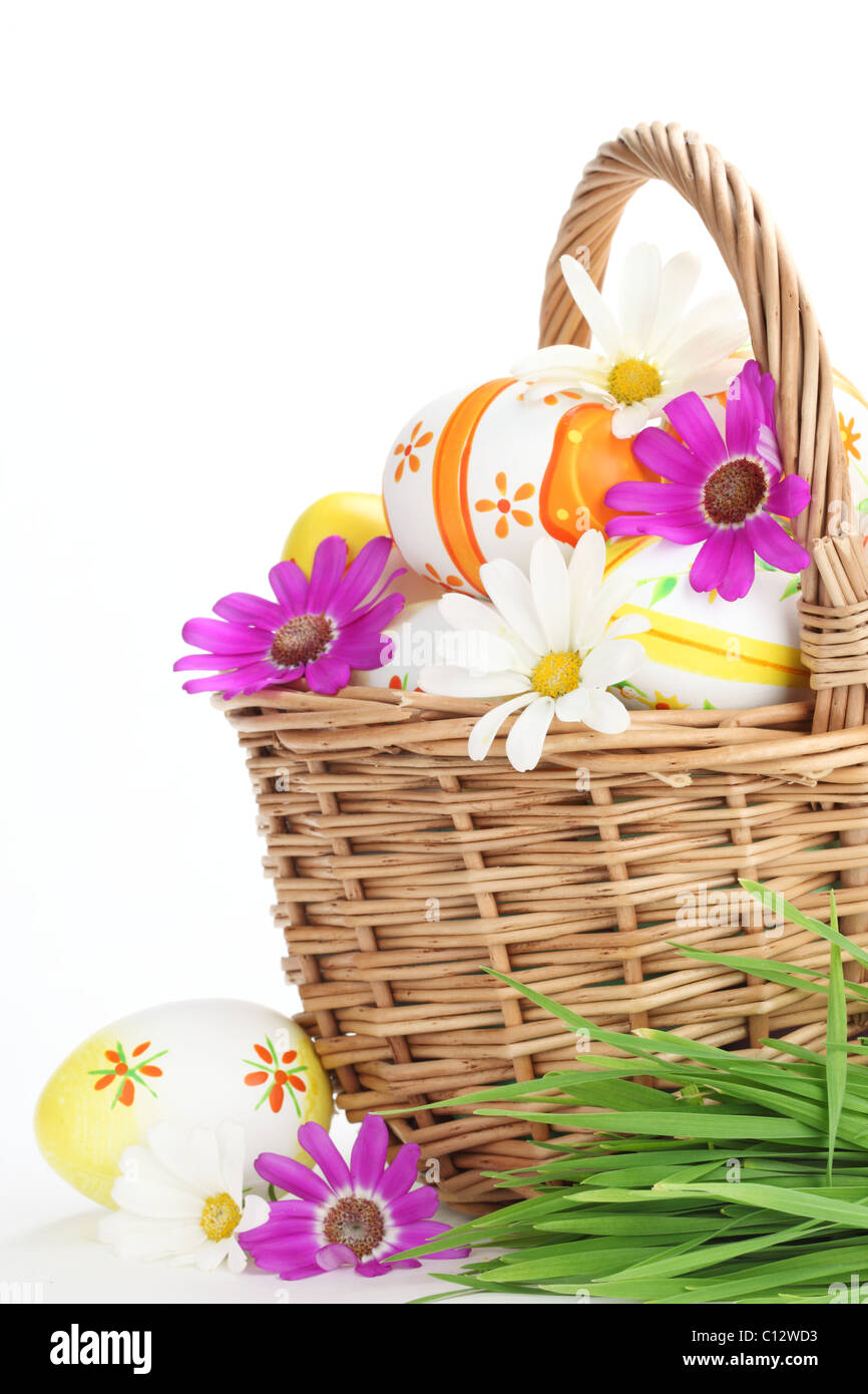 Basket full of easter eggs and spring flower Stock Photo - Alamy