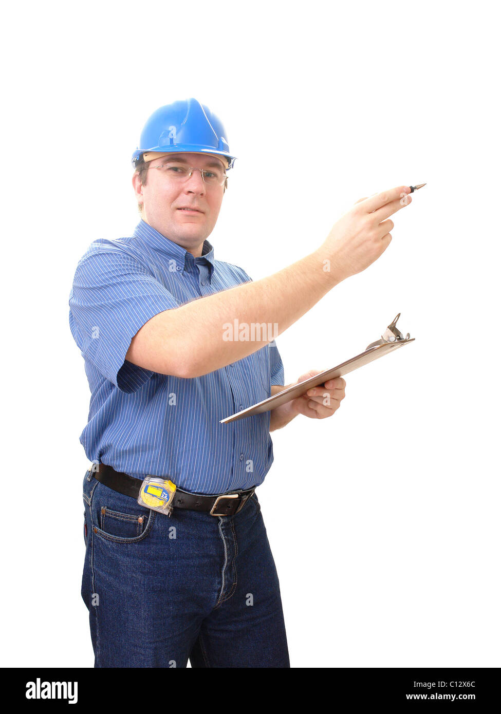 Construction site manager wearing blue helmet with notepad over white ...